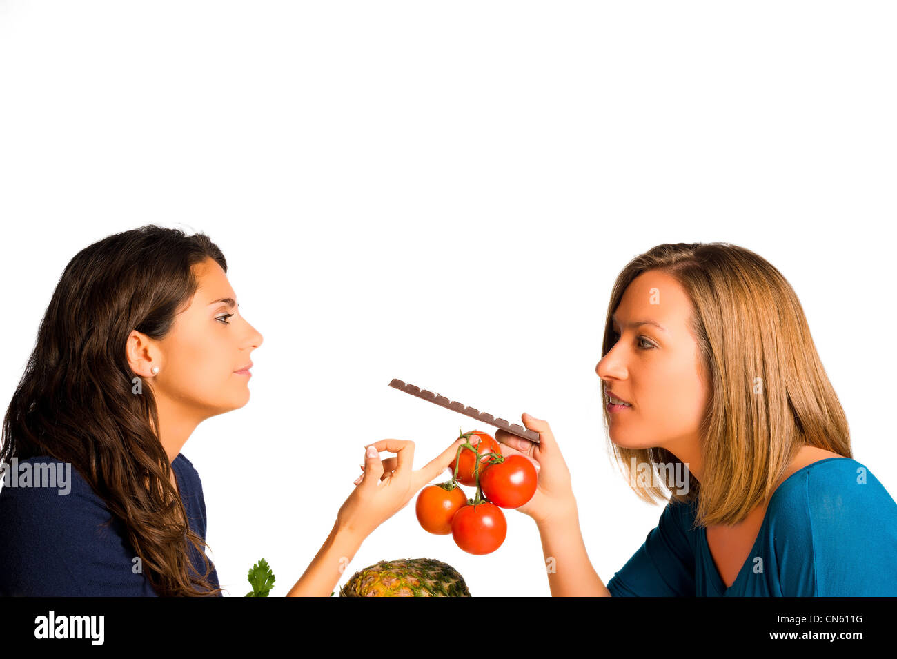 Healthy vegetables vs candy, a nutrition concept Stock Photo - Alamy