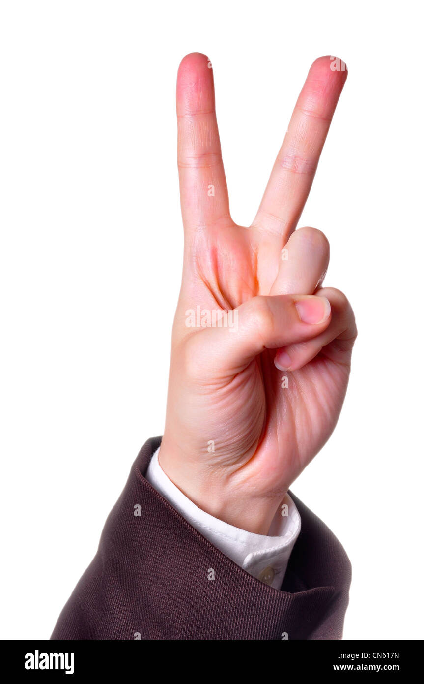 Hand in a suit making the Victory sign isolated in white background ...