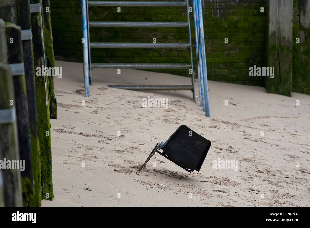 Beach with broken chair Stock Photo - Alamy