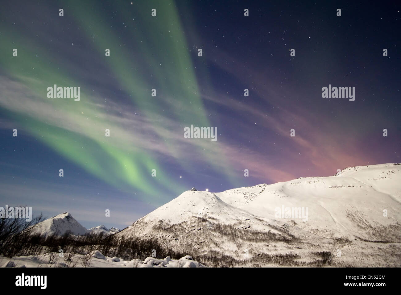 Aurora borealis or northern lights moving across night sky within the ...