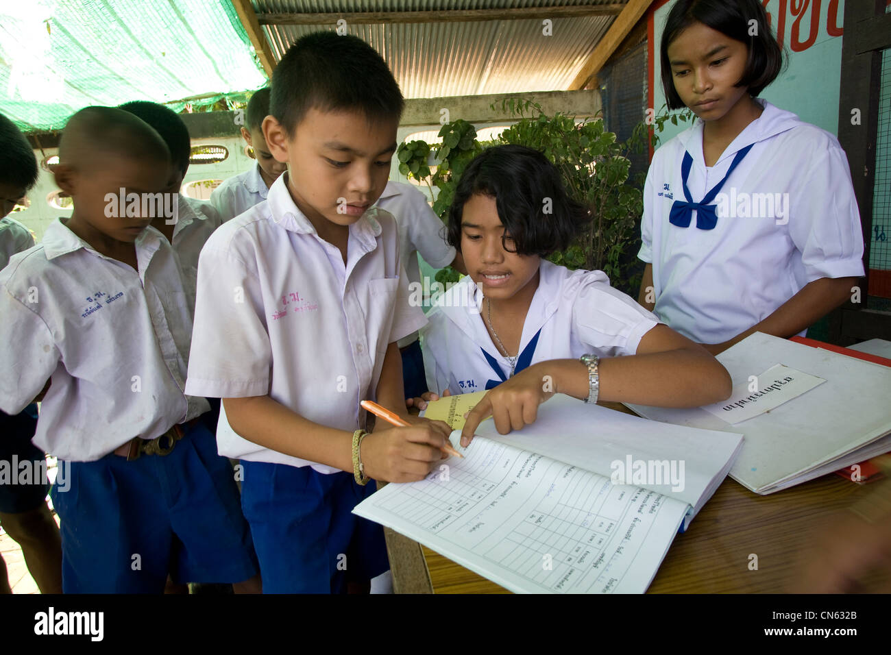 Pupils at a primary school in Songkhla collect rubbish and bring it to ...