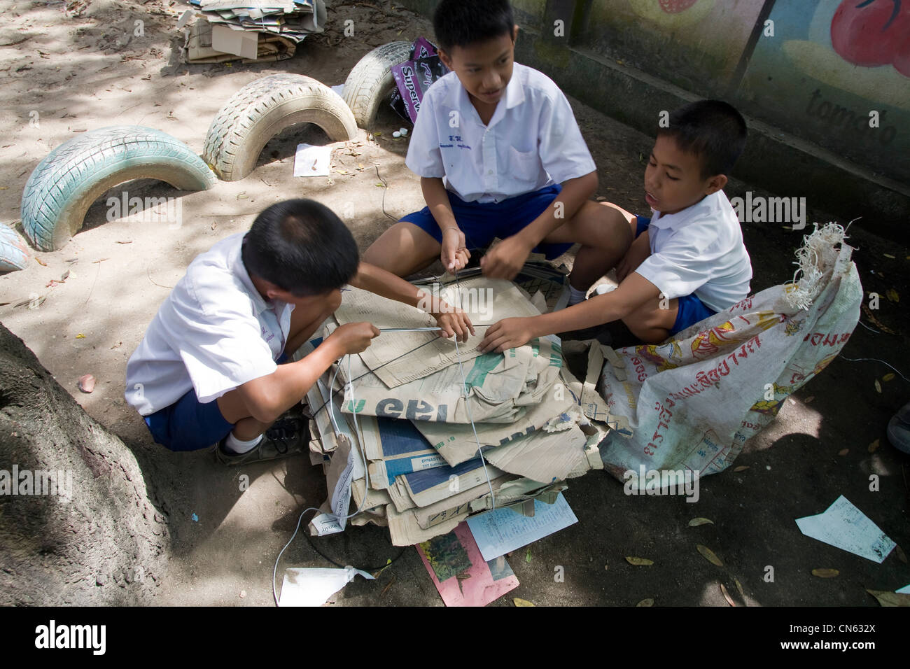 Pupils at a primary school in Songkhla collect rubbish and bring it to ...