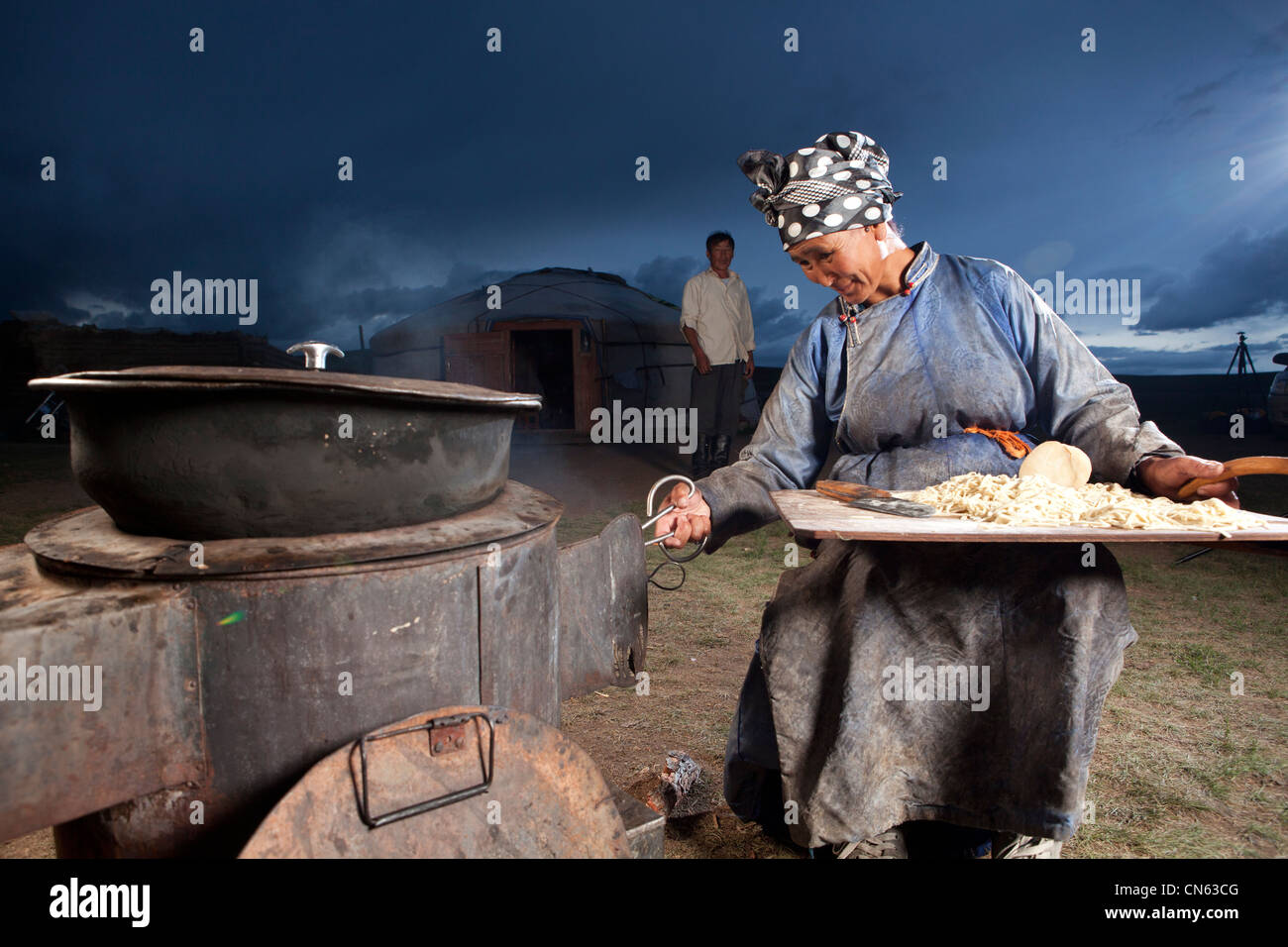 Mongolian woman cooking outside kitchen , Mongolia Stock Photo - Alamy