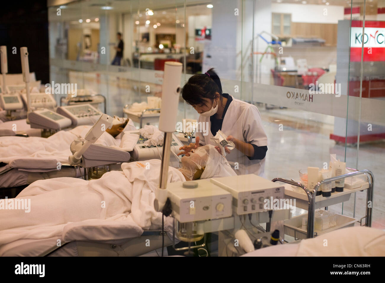 Beautician giving customer facial in hi-res stock photography and ...