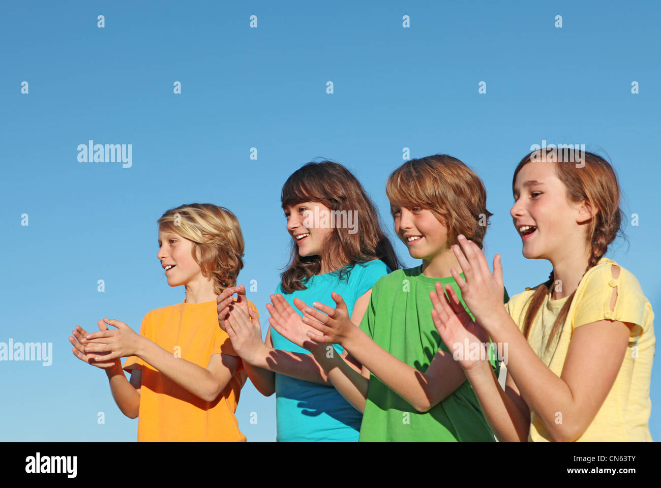 group of kids, children, or supporters clapping Stock Photo - Alamy