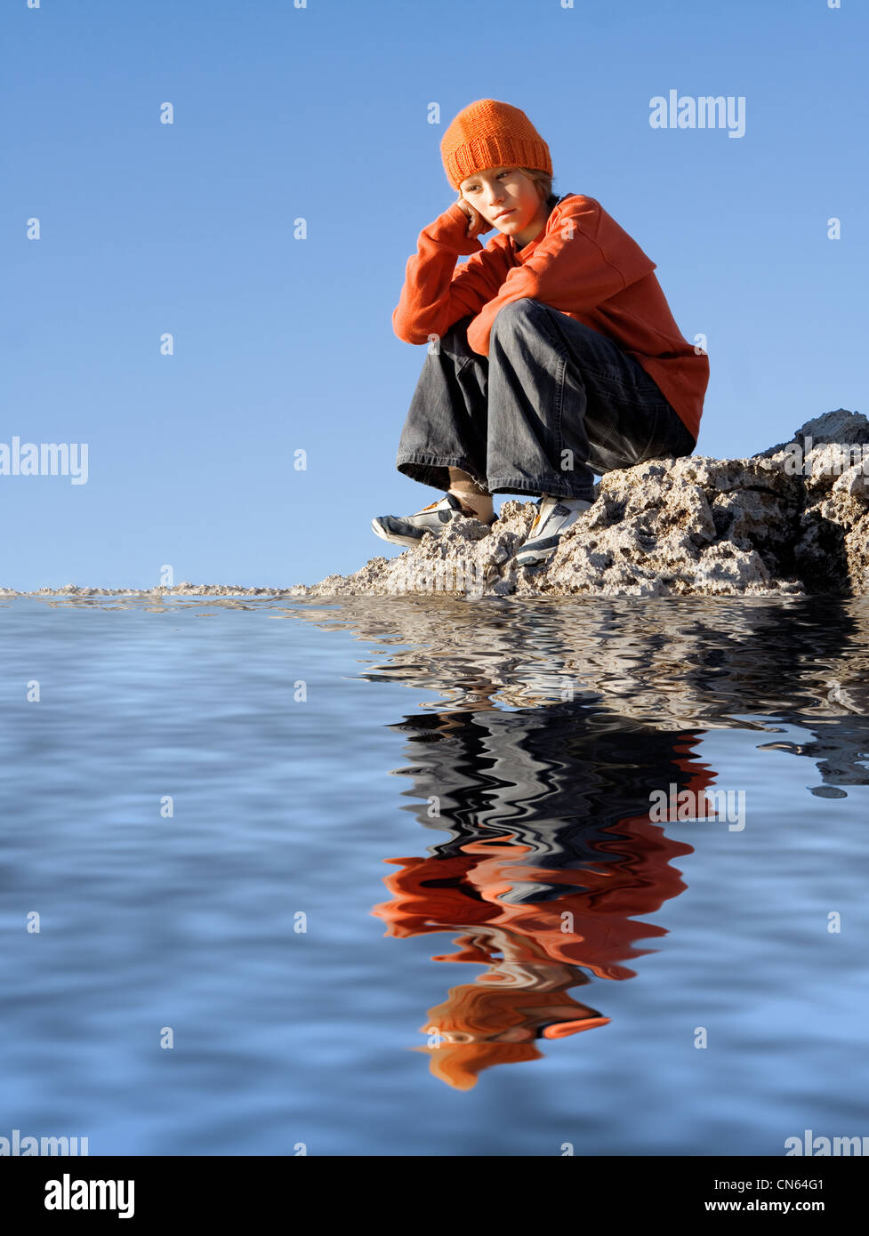 sad lonely depressed child sitting alone outdoors Stock Photo - Alamy