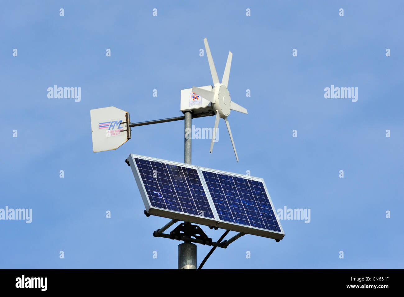 Solar panel and wind turbine powering a road sign. Kirkstone Pass, Lake ...