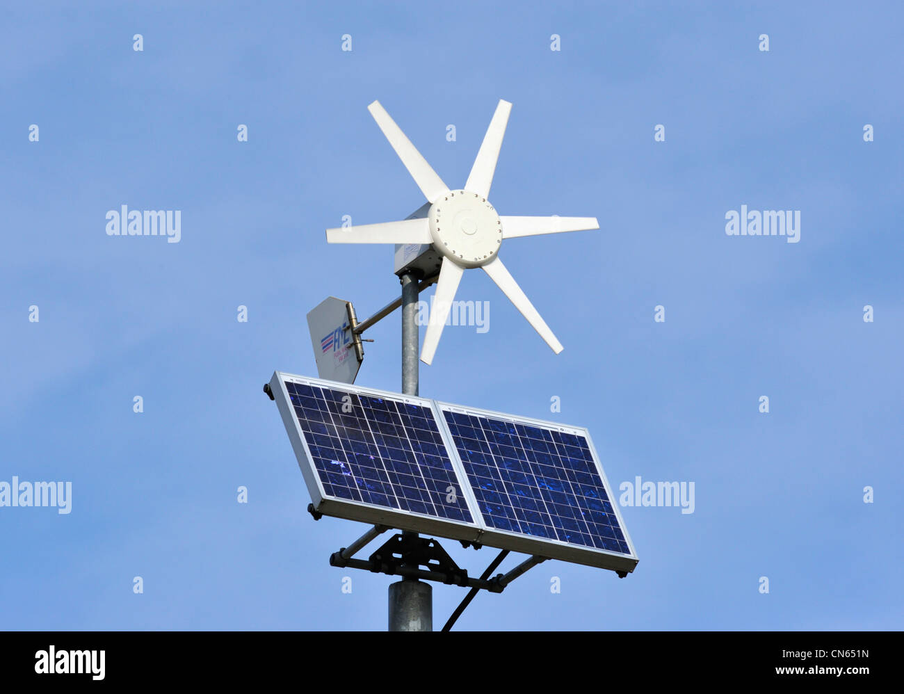 Solar panel and wind turbine powering a road sign. Kirkstone Pass, Lake ...