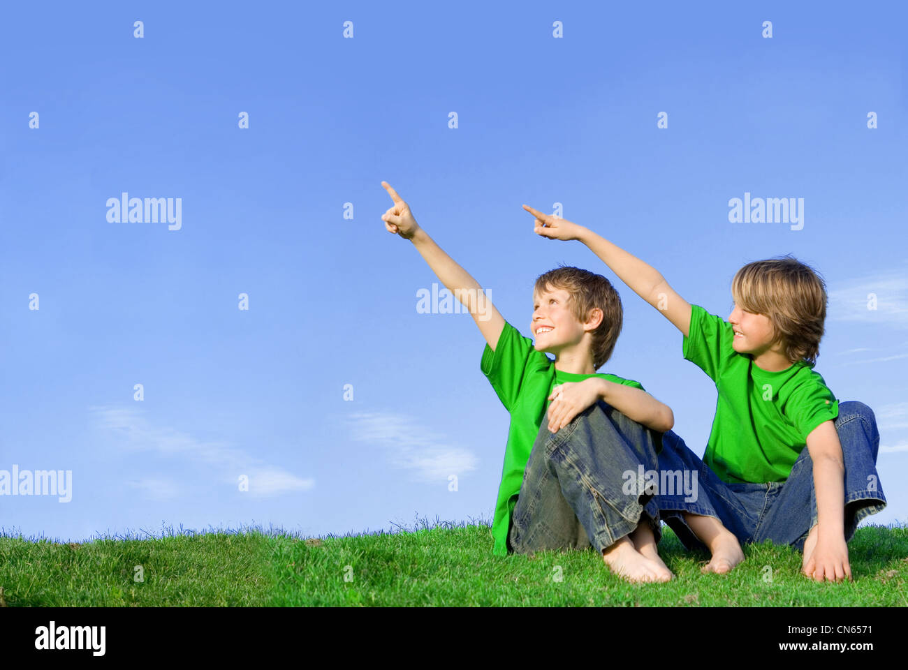 kids or children pointing at copy space outdoors in summer Stock Photo ...