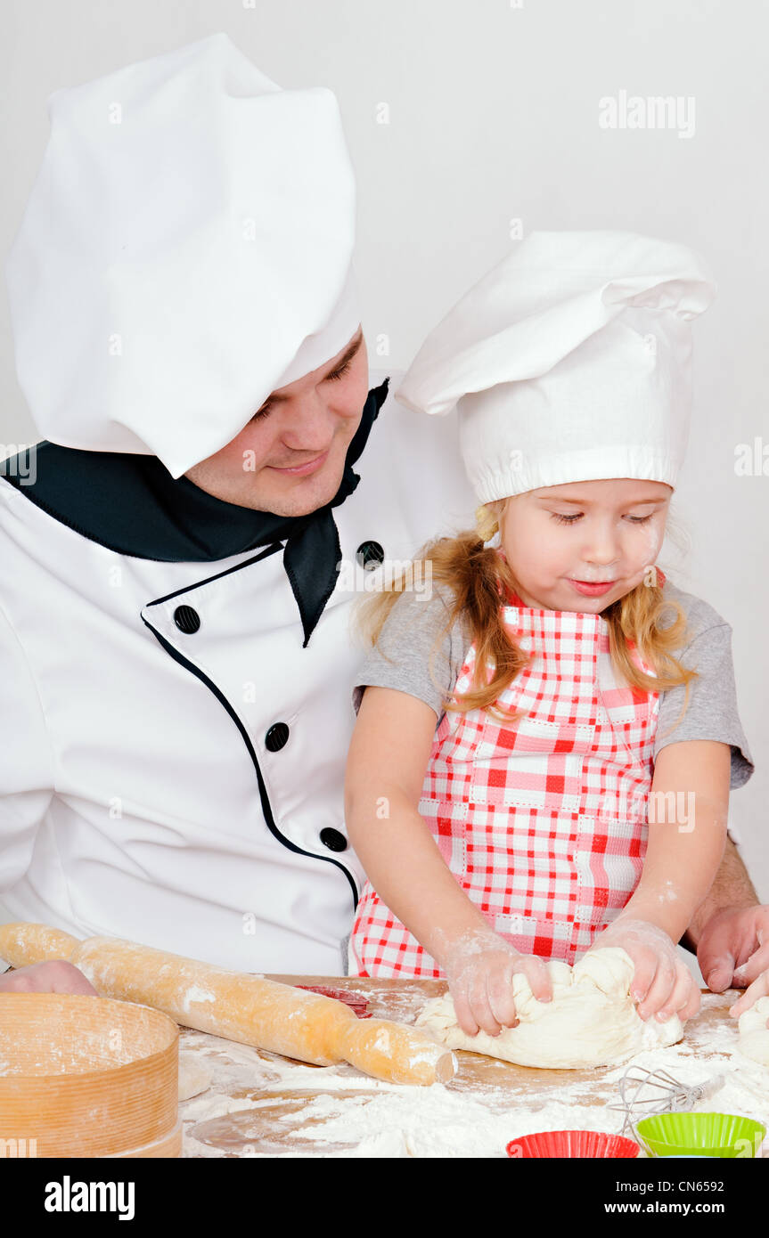 Chef teaches girl to knead the dough Stock Photo - Alamy