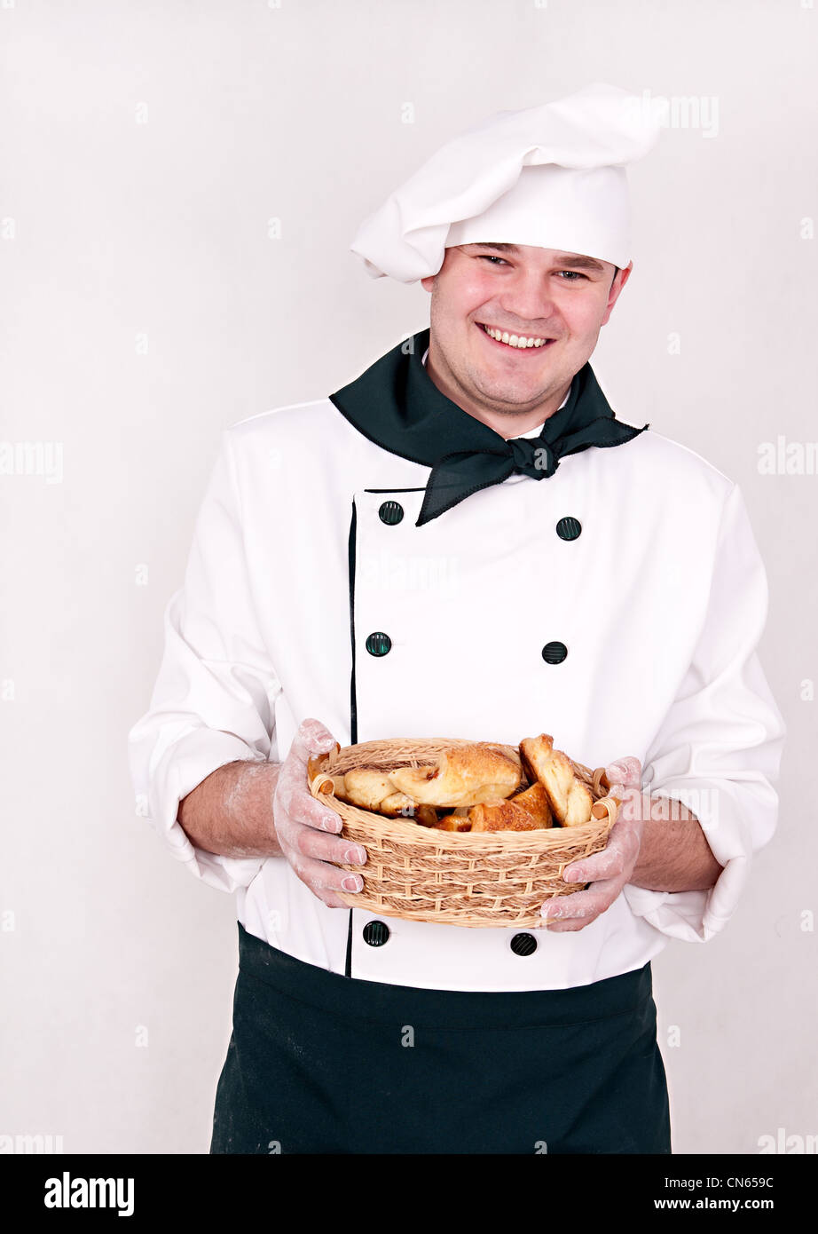 chef keeps basket with buns isolated on white background Stock Photo ...