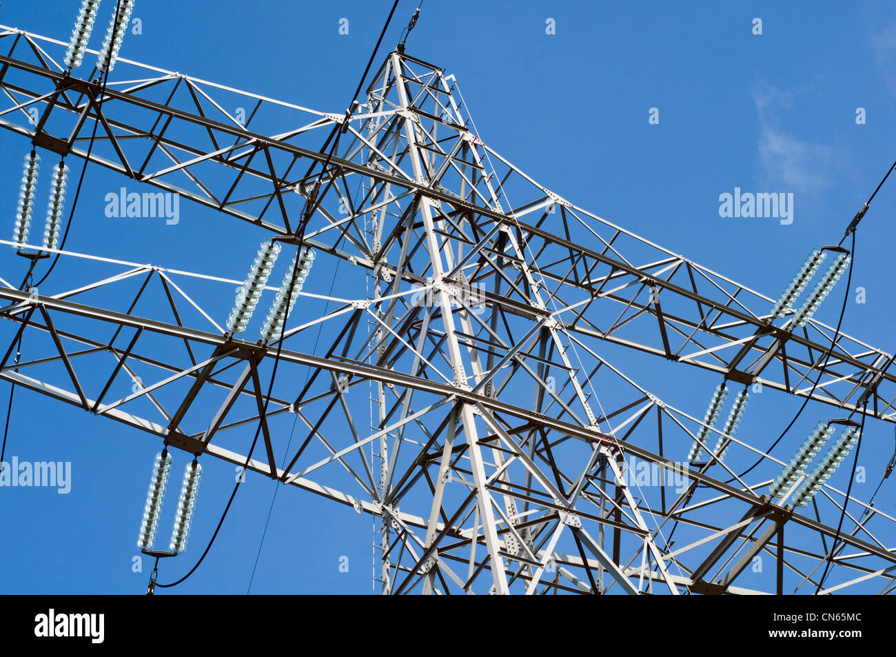 An electricity pylon against a clear blue sky Stock Photo - Alamy