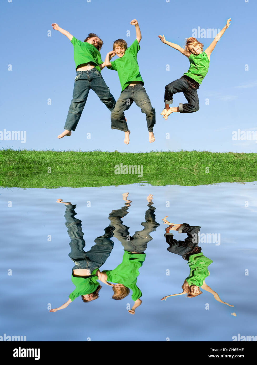 group or team of kids jumping for joy celebrating win Stock Photo - Alamy
