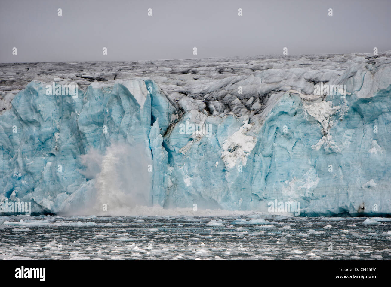 Norway Svalbard Spitsbergen Island Icebergs calving into sea from blue ...