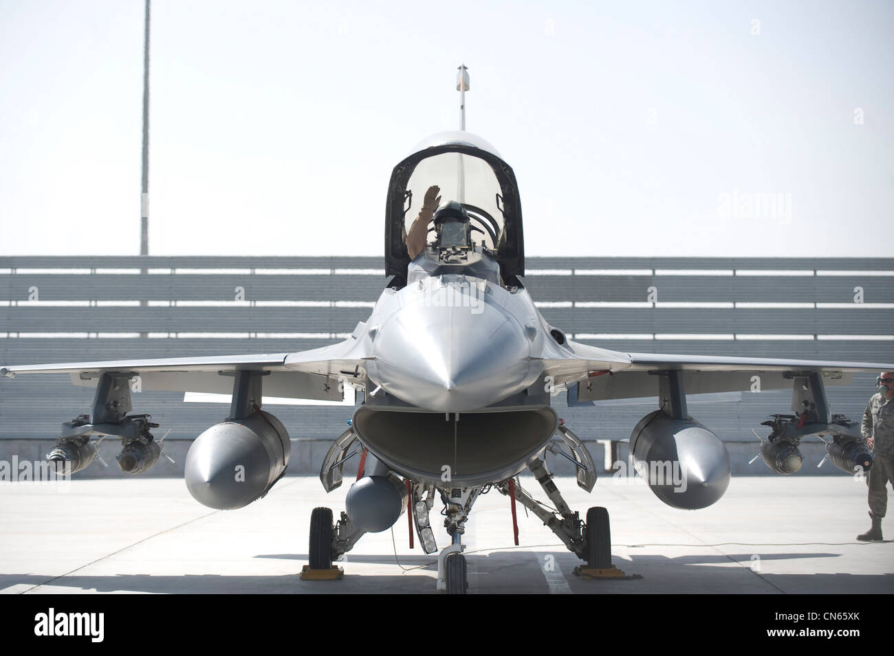 An f 16c pilot with the 451st expeditionary fighter squadron hi-res ...