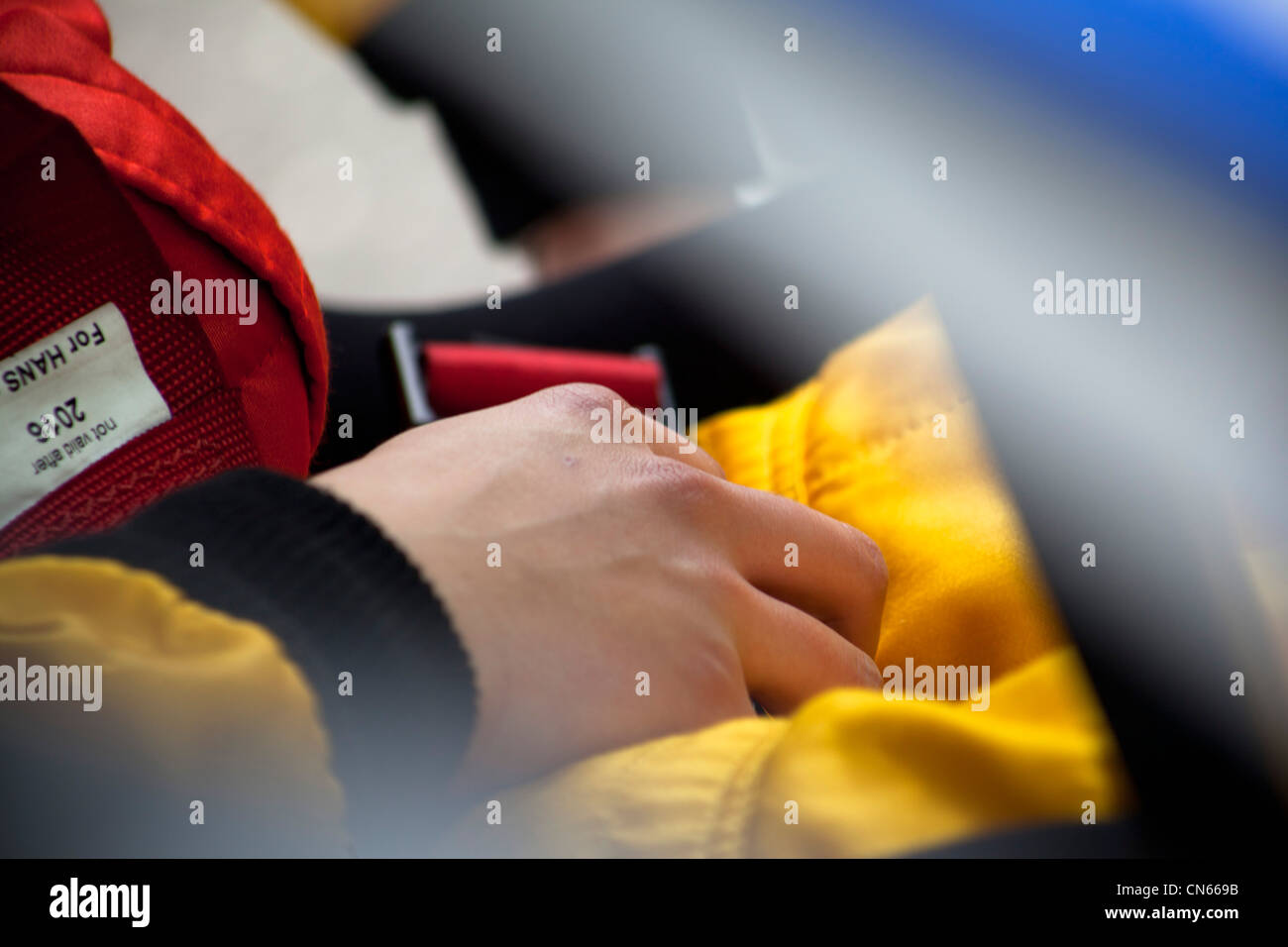 Racing driver preparing for a race Stock Photo - Alamy