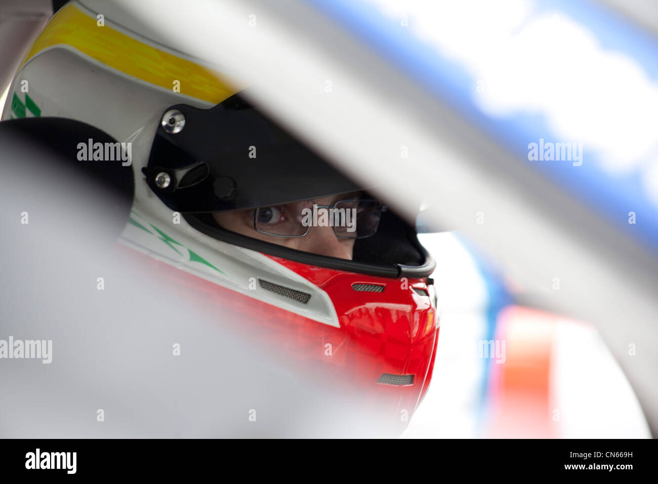 Racing driver preparing for a race Stock Photo - Alamy