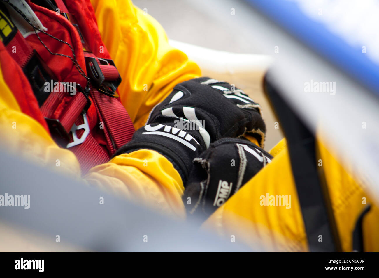 Racing driver preparing for a race Stock Photo - Alamy