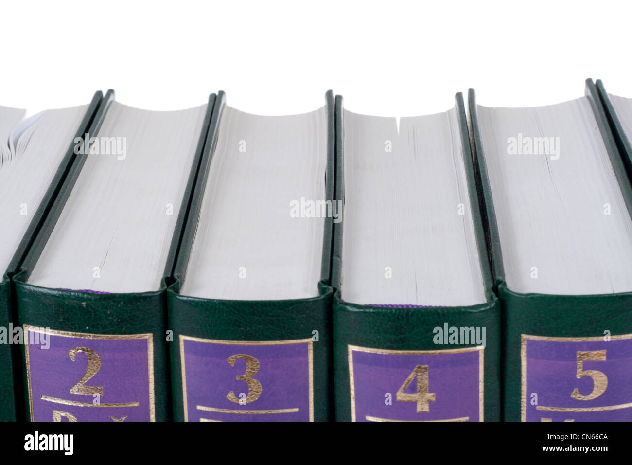 Volumes of books in a row Stock Photo - Alamy