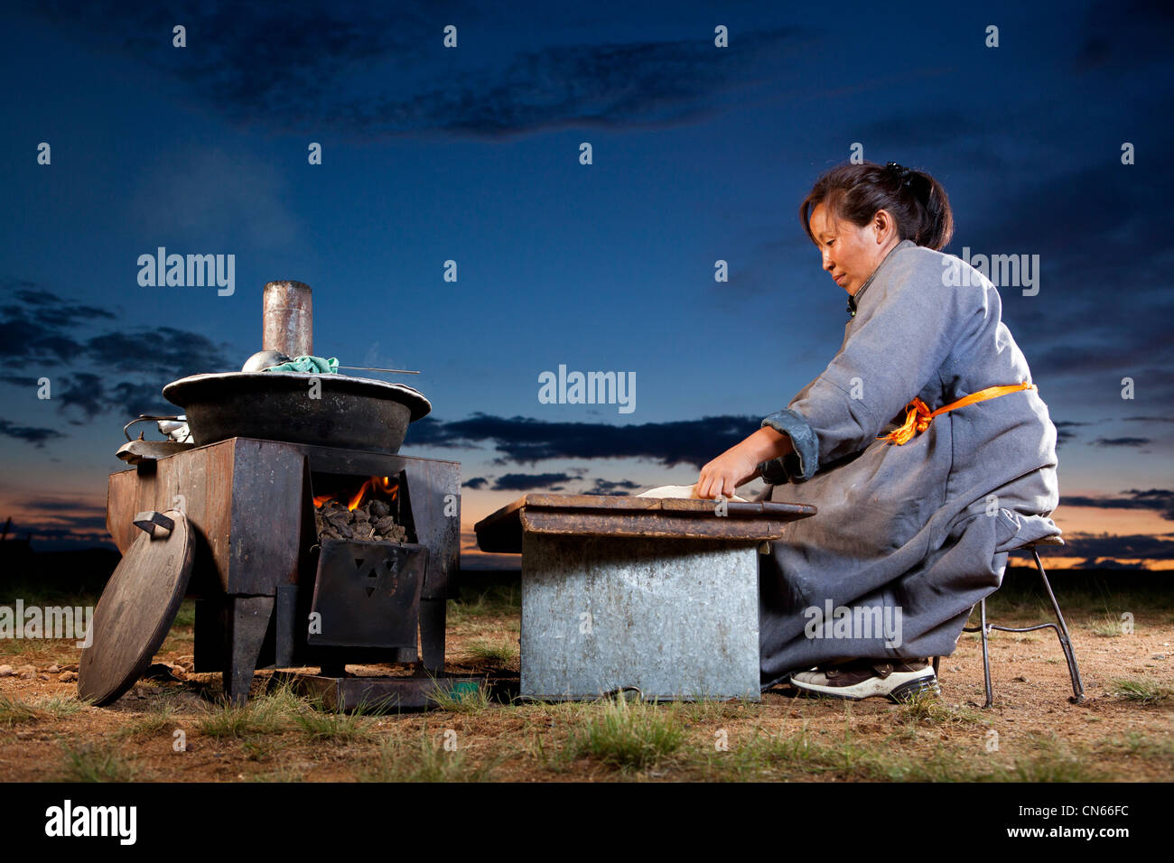 Mongolian woman cooking outside kitchen , Mongolia Stock Photo - Alamy
