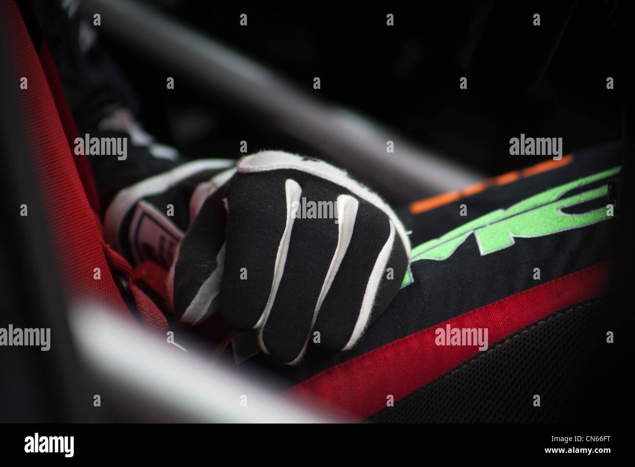 Racing driver preparing for a race Stock Photo - Alamy