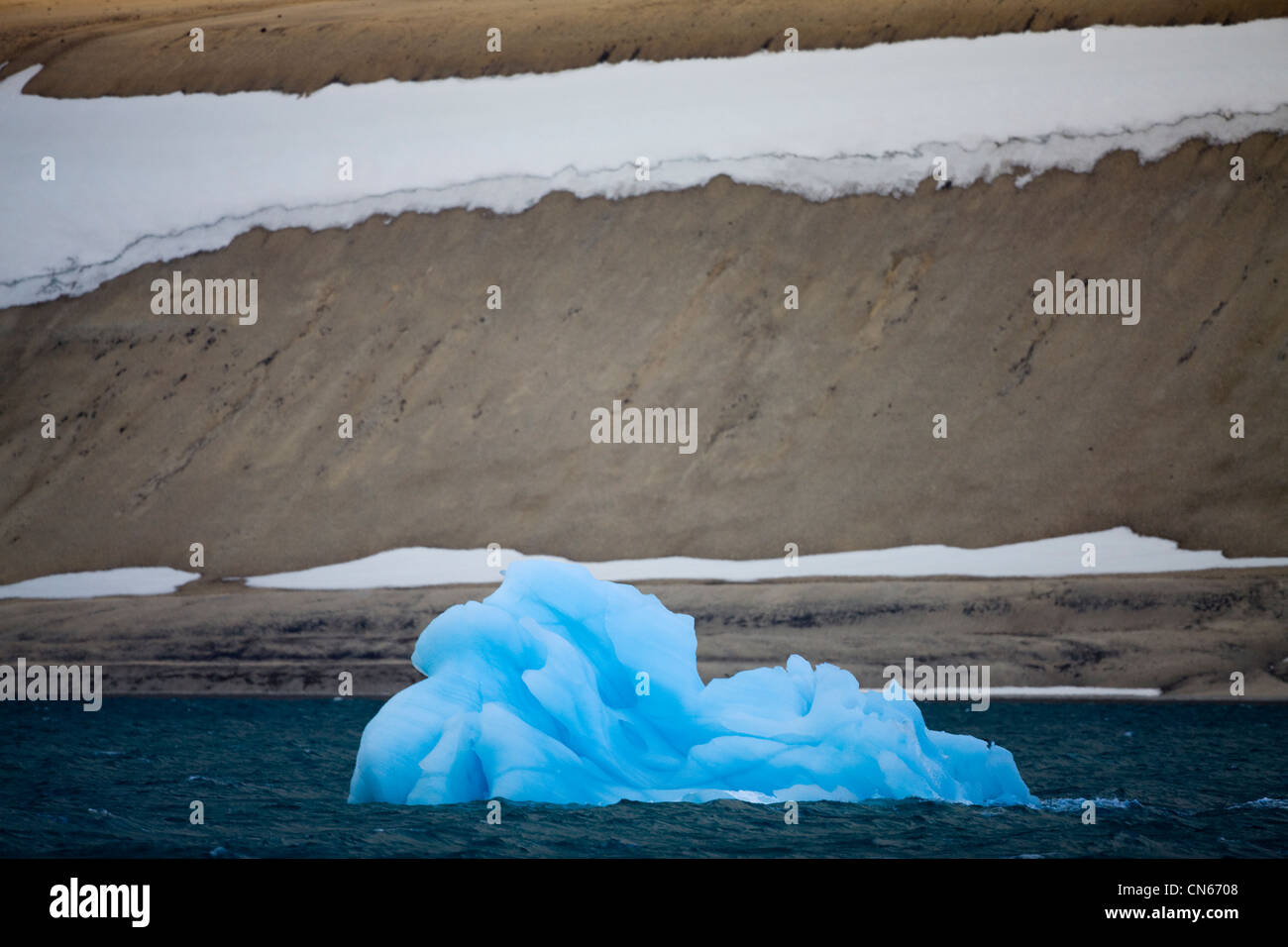 Norway, Svalbard, Nordaustlandet, Deep blue iceberg floating in ...