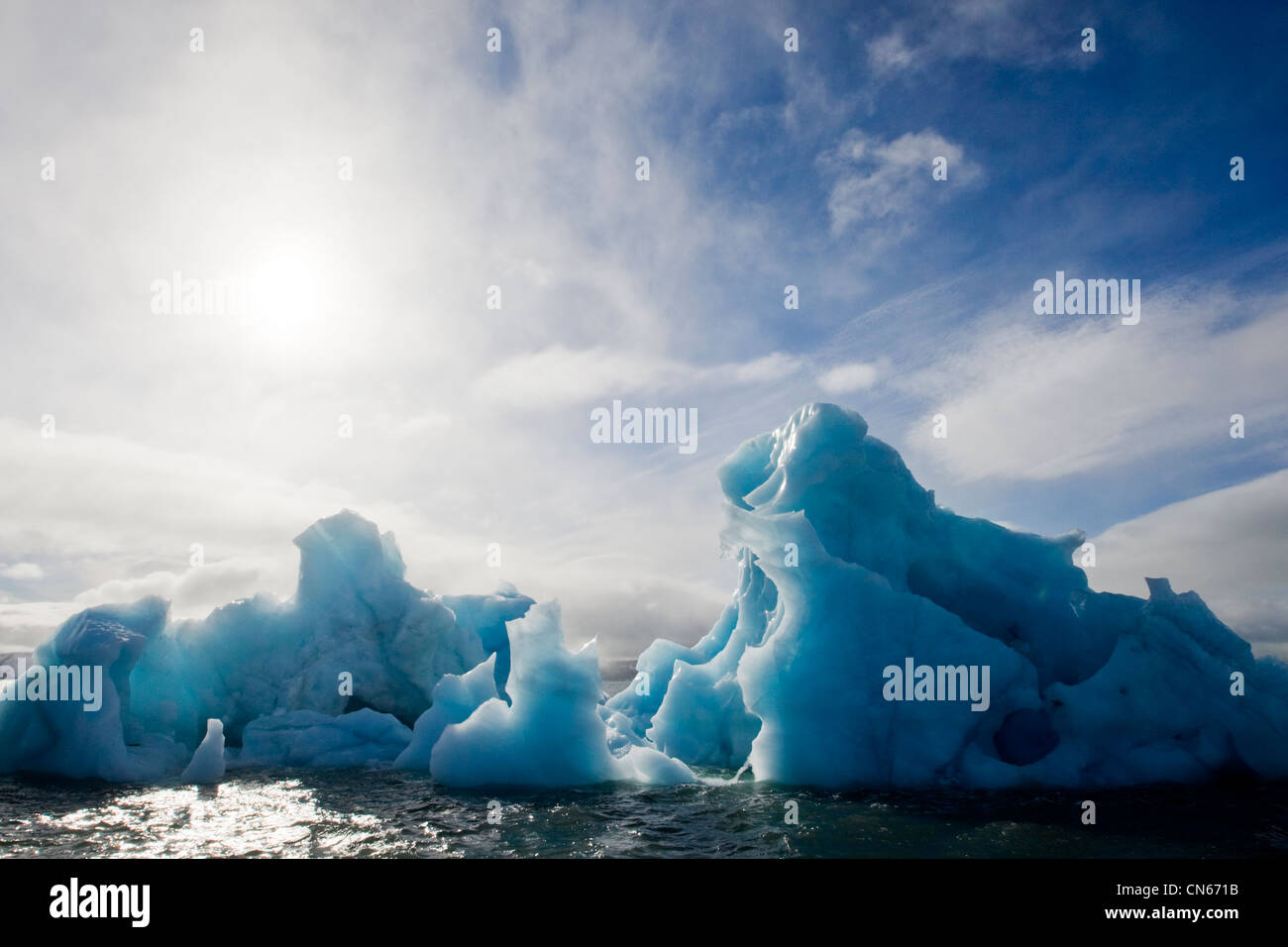 Norway, Svalbard, Nordaustlandet, Deep blue iceberg floating in ...