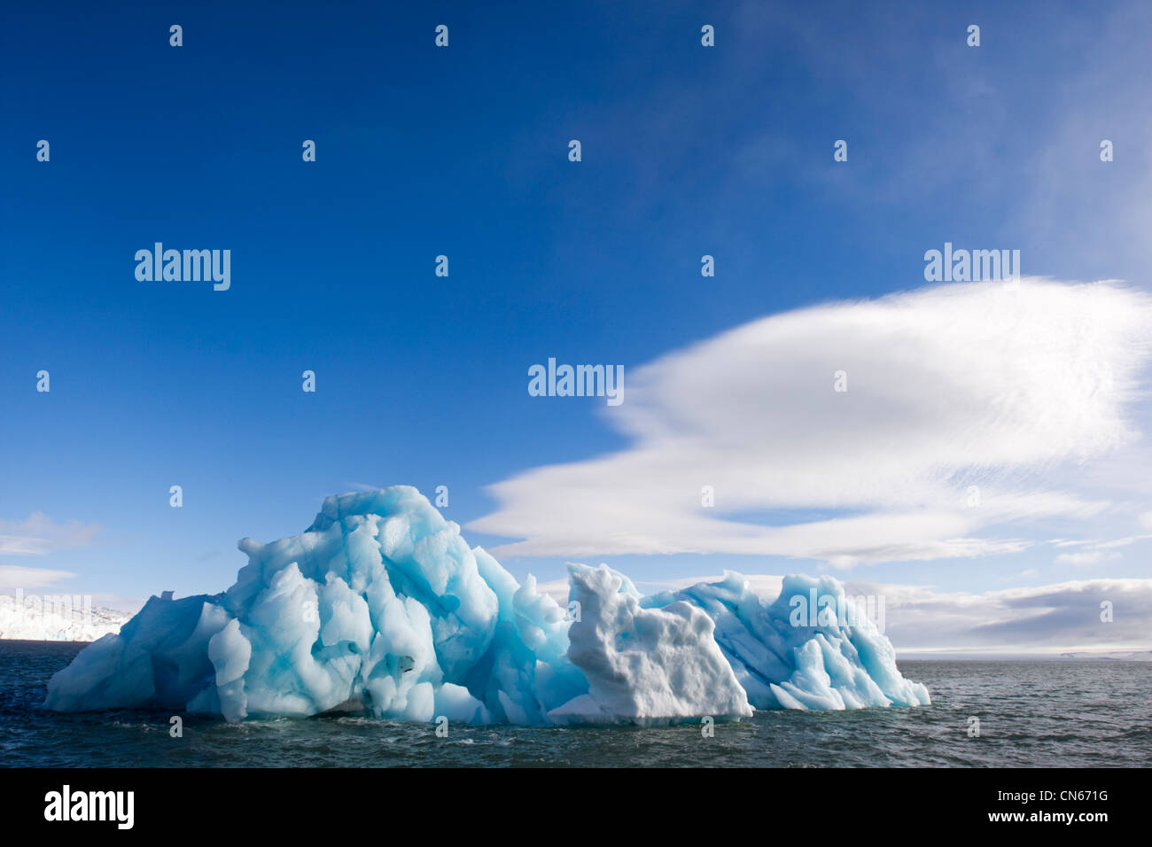 Norway, Svalbard, Nordaustlandet, Deep blue iceberg floating in ...