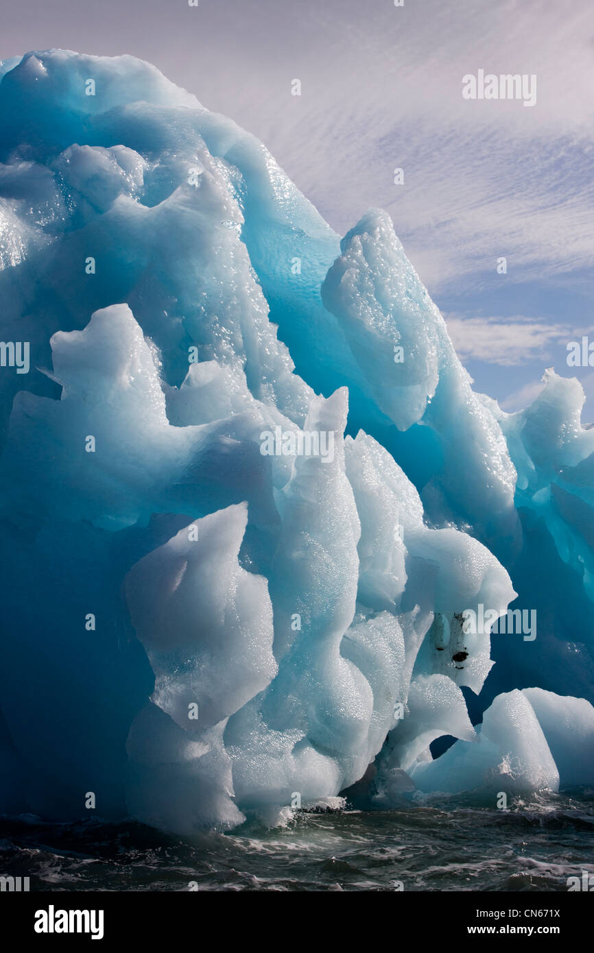 Norway, Svalbard, Nordaustlandet, Deep blue iceberg floating in ...