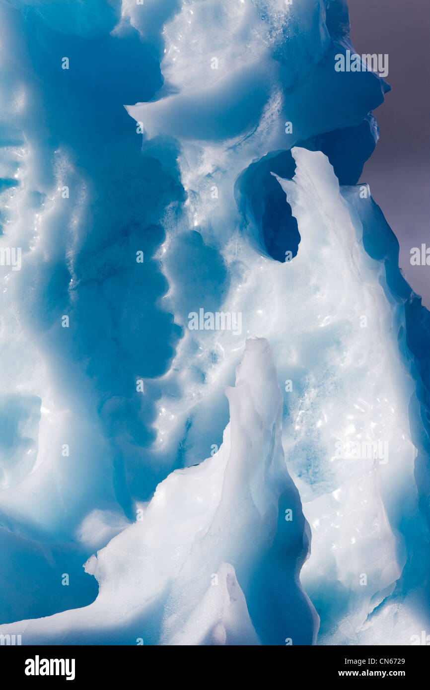 Norway, Svalbard, Nordaustlandet, Deep blue iceberg floating in ...