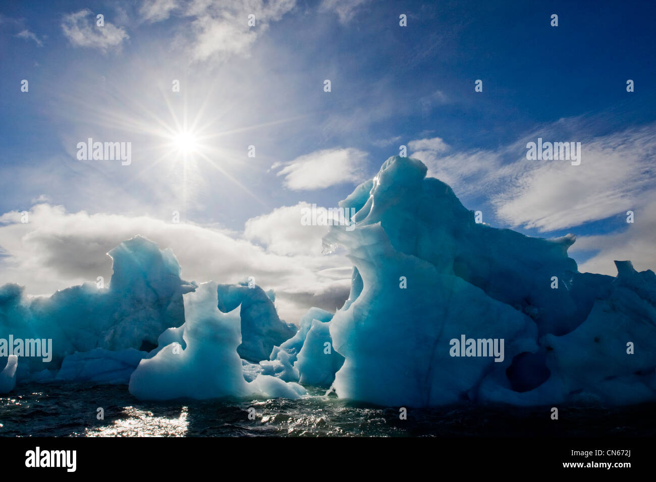 Norway, Svalbard, Nordaustlandet, Deep blue iceberg floating in ...