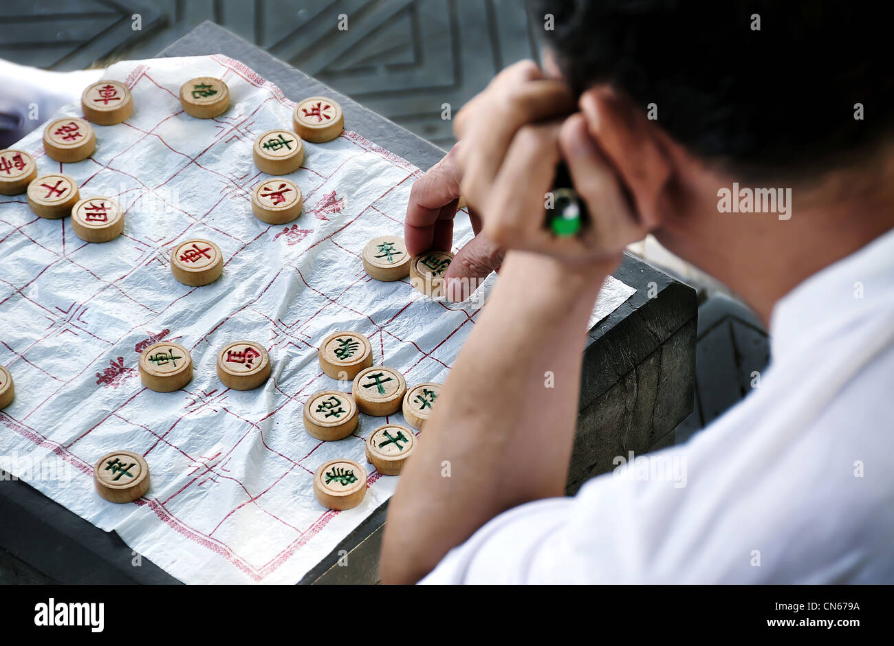 Man playing the game of Xiangqi, or Chinese Chess, China Stock Photo ...
