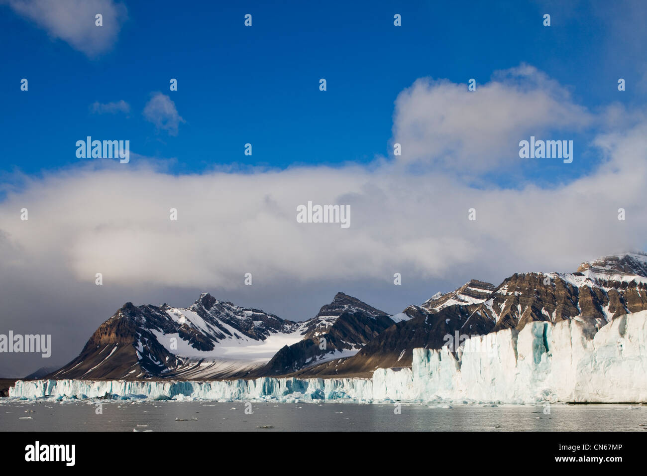 Norway, Svalbard, Spitsbergen Island, Morning sun lights ice face of ...