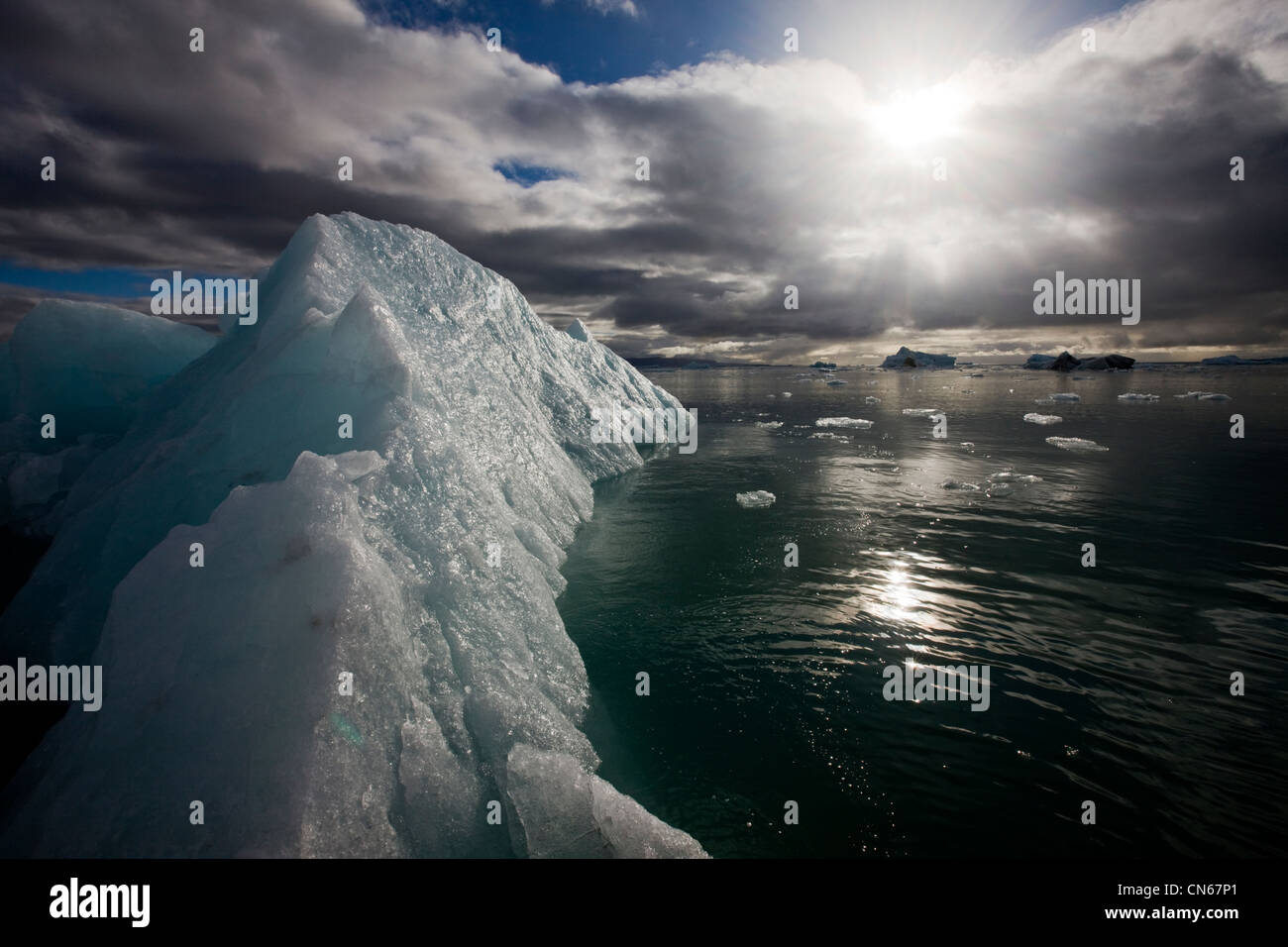Norway, Svalbard, Spitsbergen Island, Morning sun lights iceberg ...