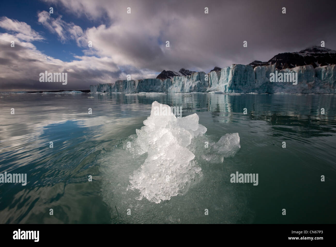 Norway, Svalbard, Spitsbergen Island, Morning sun lights iceberg ...