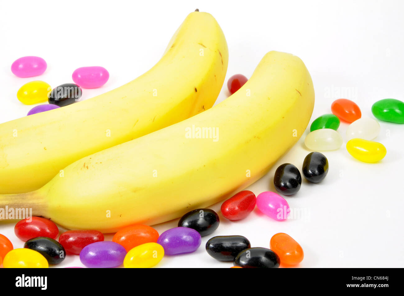 Isolated banana and candy Stock Photo - Alamy