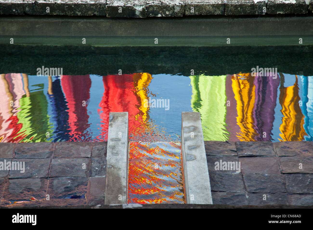 Flags reflected in a pond Bali Indonesia Stock Photo - Alamy