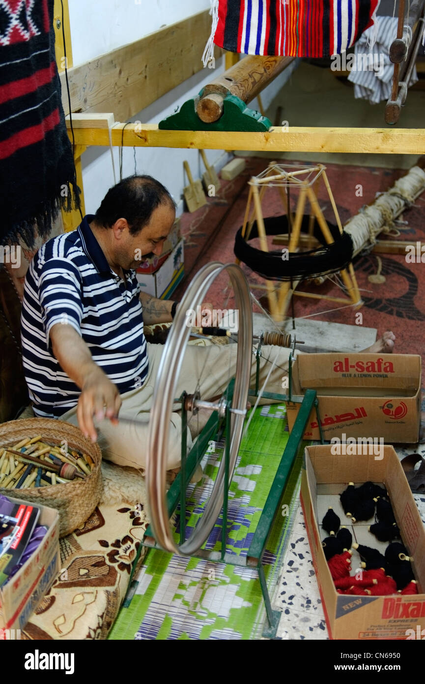 Tripoli. Libya. View of man hand working wool textile looming wheel in ...