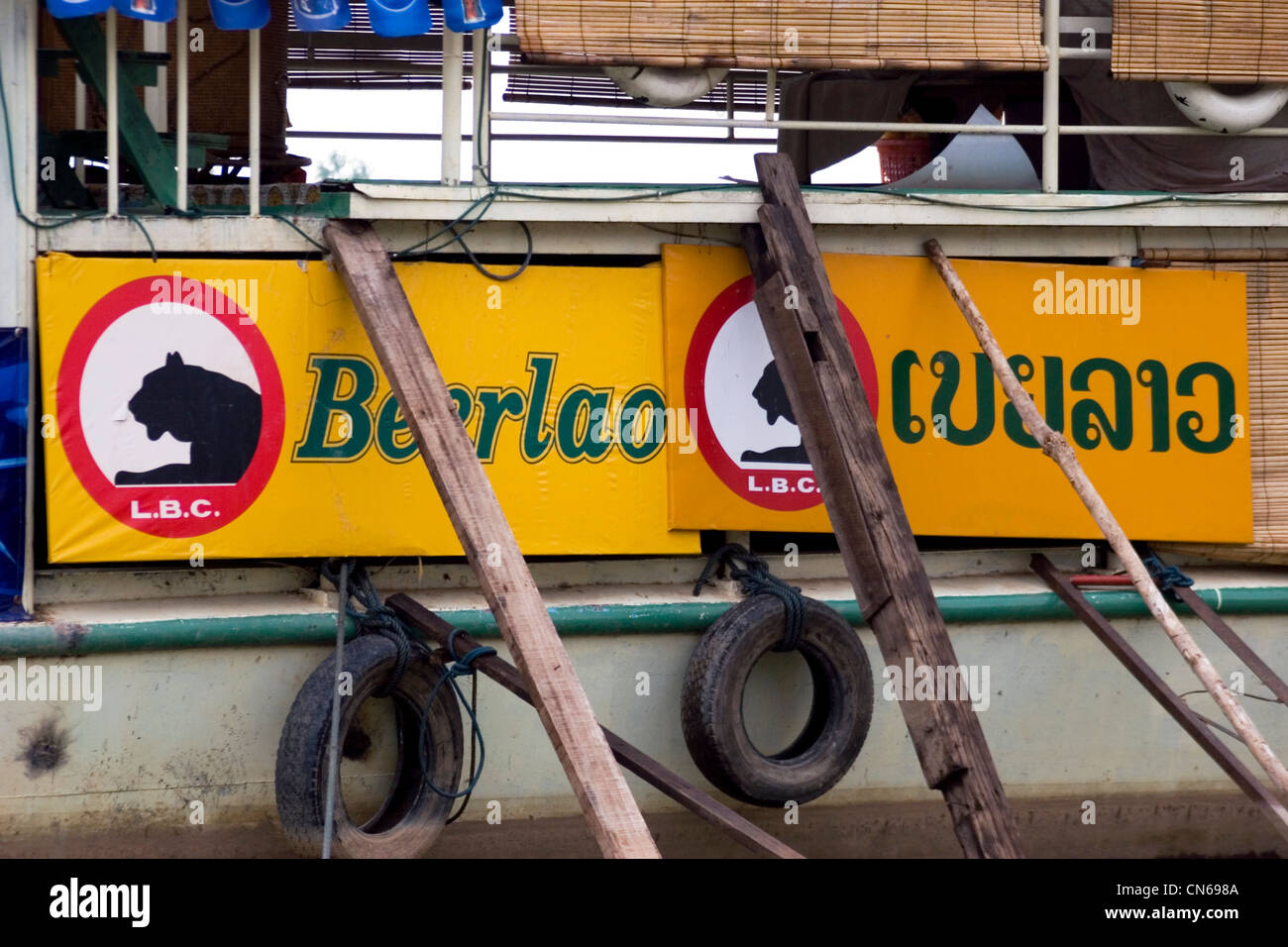 A bar serves Beerlao to tourists and residents alike on a floating bar ...
