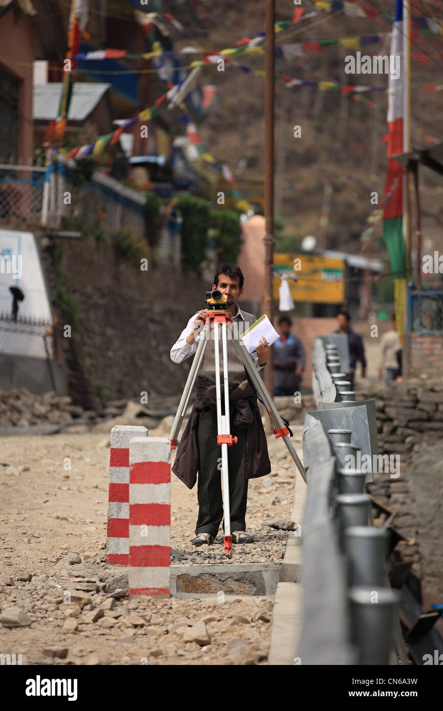 Nepali man measuring the road Nepal Stock Photo - Alamy