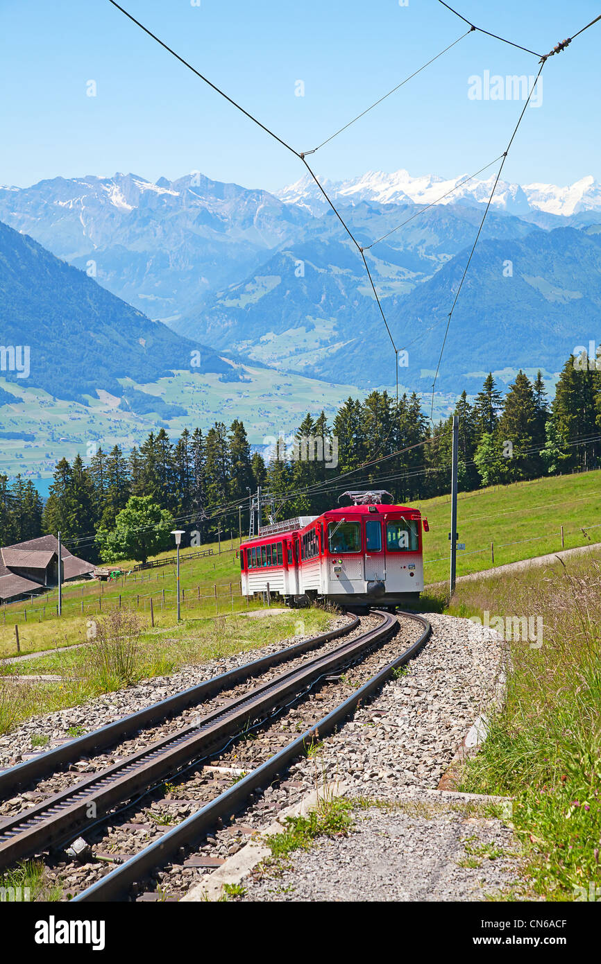 Swiss alpine cog railway train climbing up to the mount Rigi Stock ...