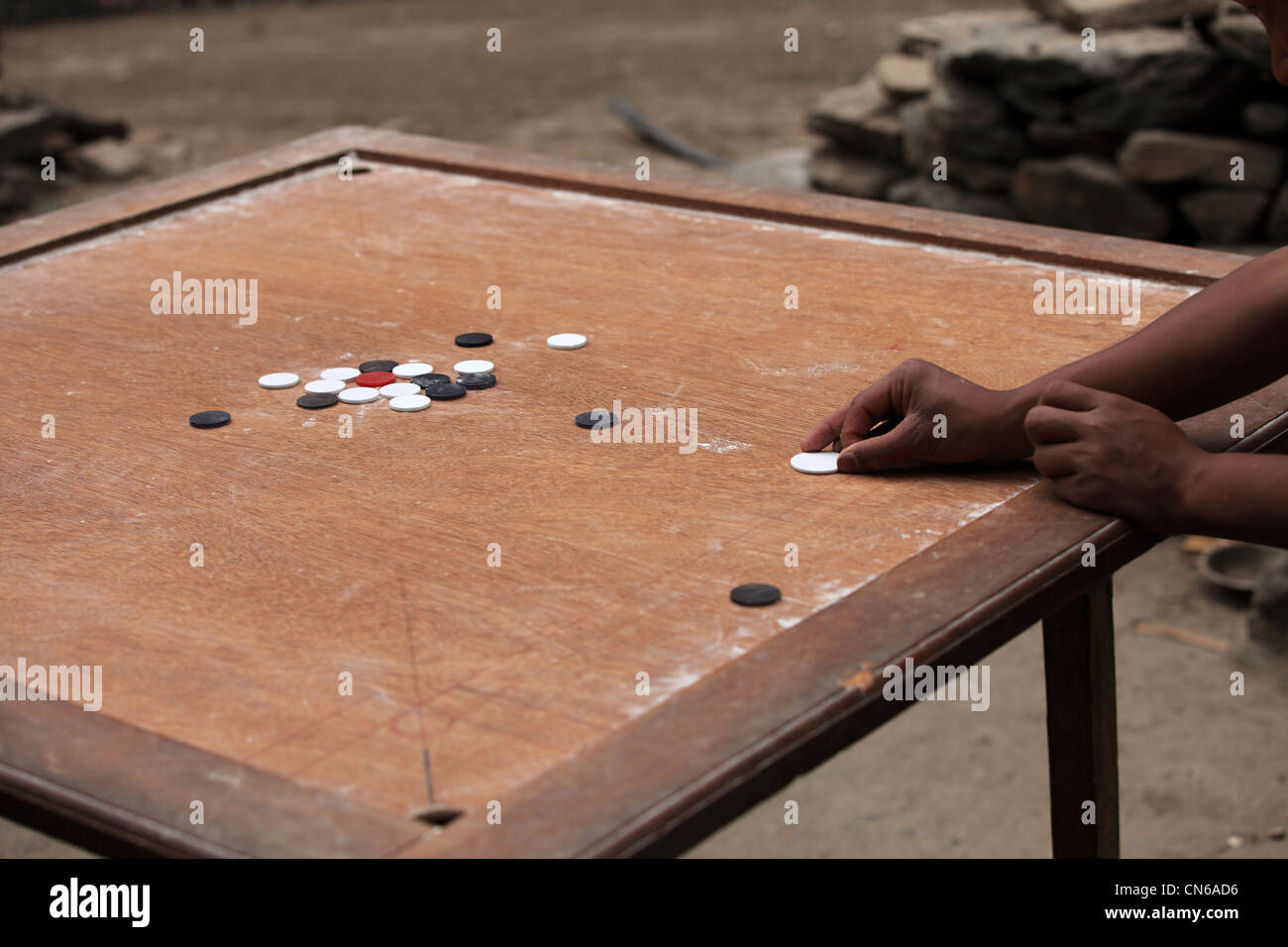 Nepali teenager playing push billiard Nepal Stock Photo - Alamy