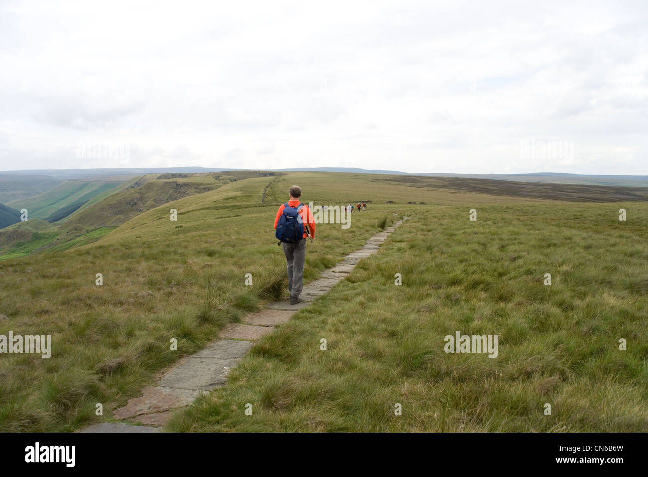 Group of Ramblers walking above Alport Valley by Alport Castles in ...