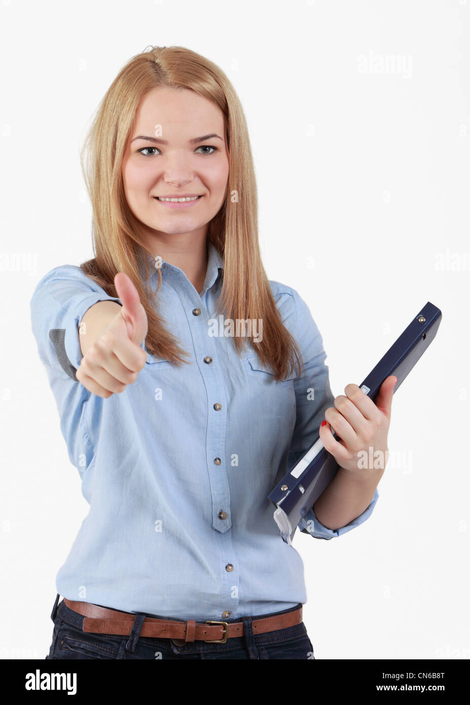 Portrait of an optimistic student blond girl with her right thumb up ...