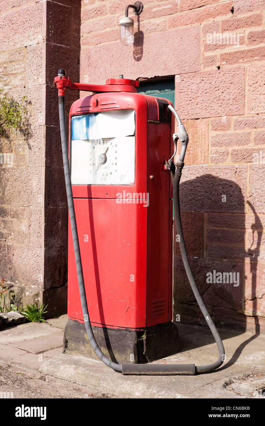 An old red disused fuel pump Stock Photo - Alamy