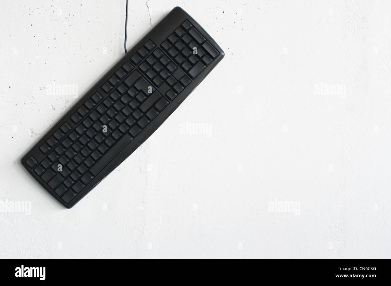 Isolated blank keyboard hanging on the wall Stock Photo - Alamy