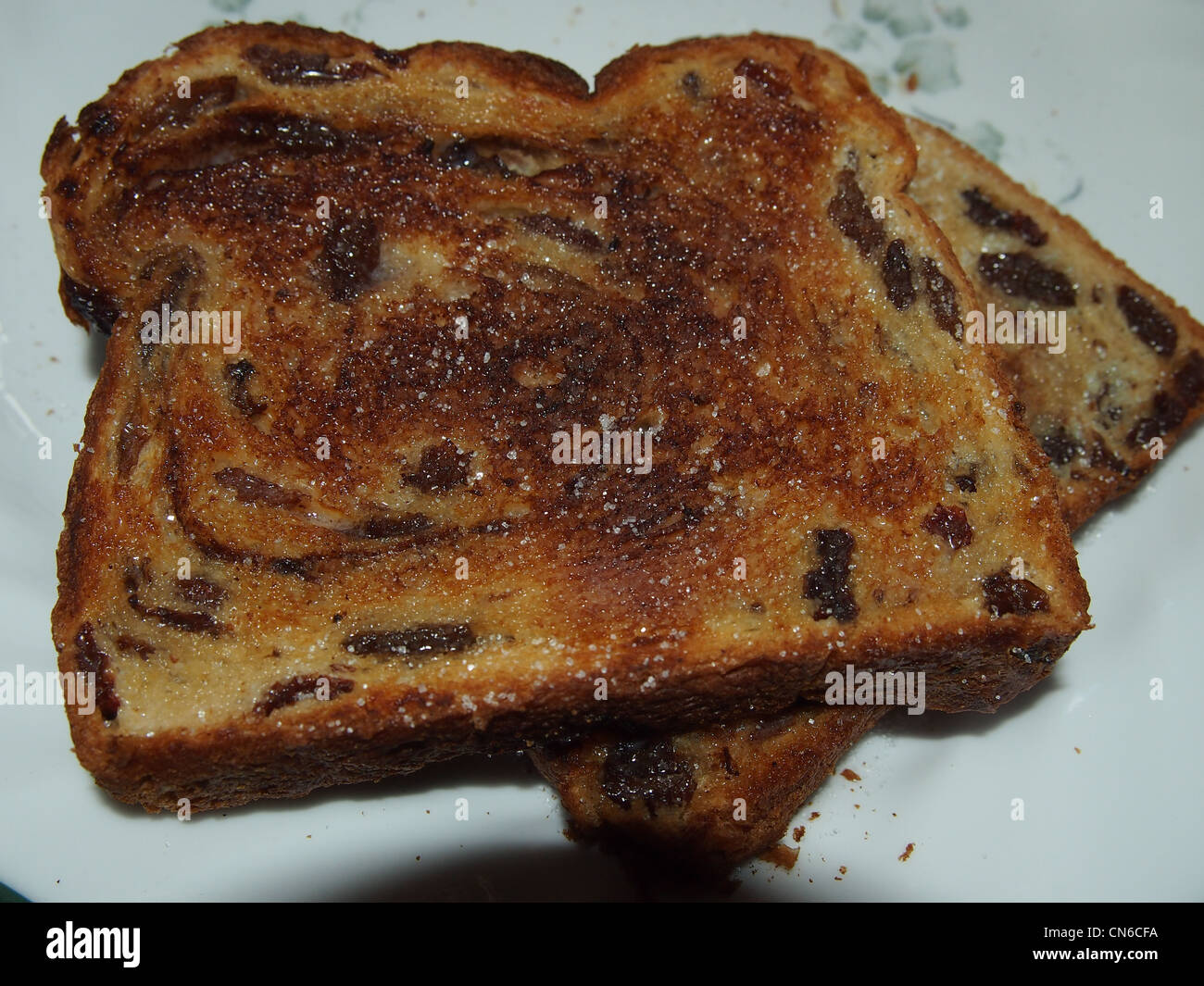 two slices of raisin toast Stock Photo - Alamy