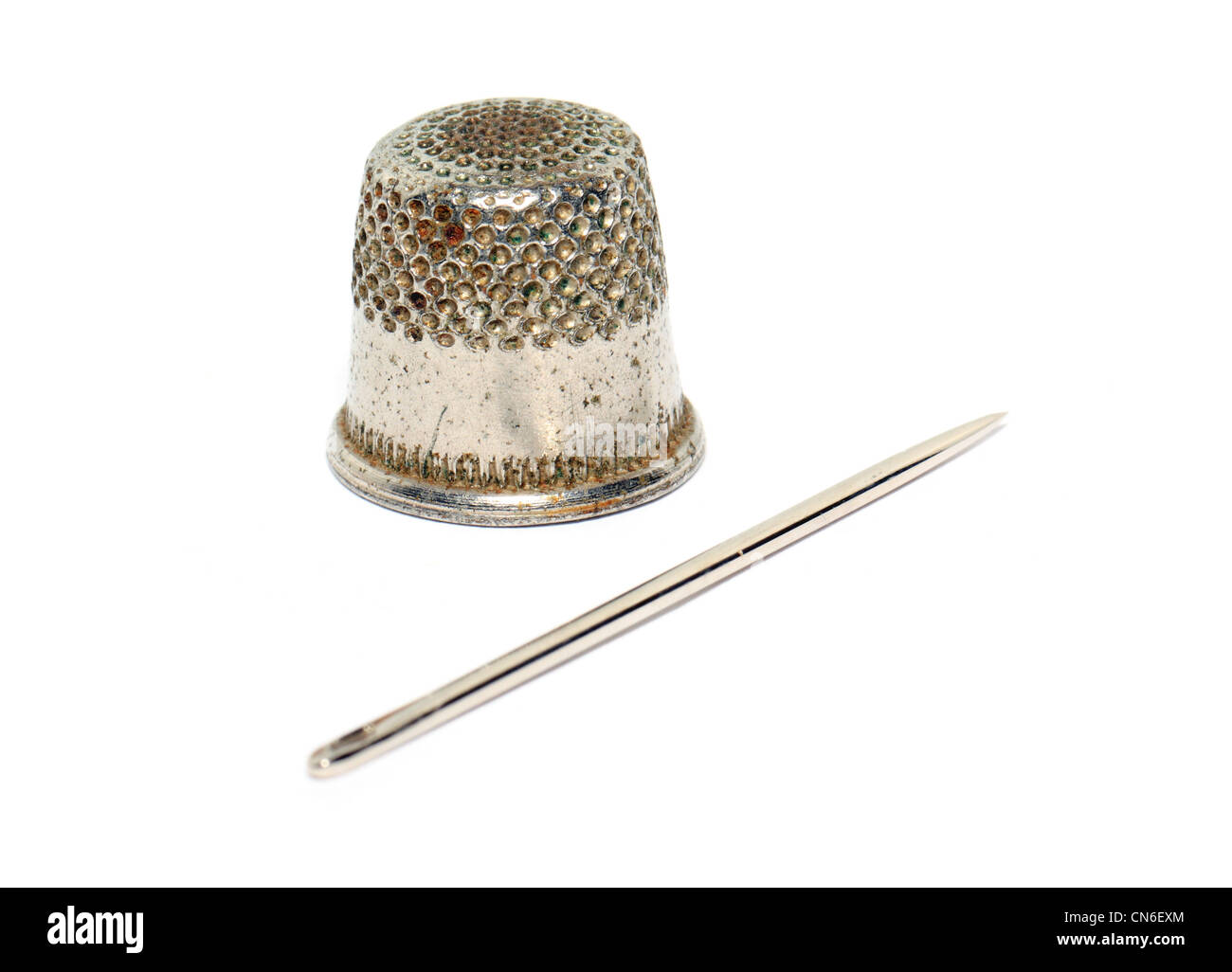 old thimble on white background Stock Photo - Alamy