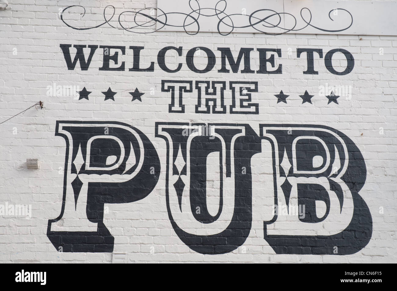 "Welcome To The Pub " sign painted on the the side of The Pub ...