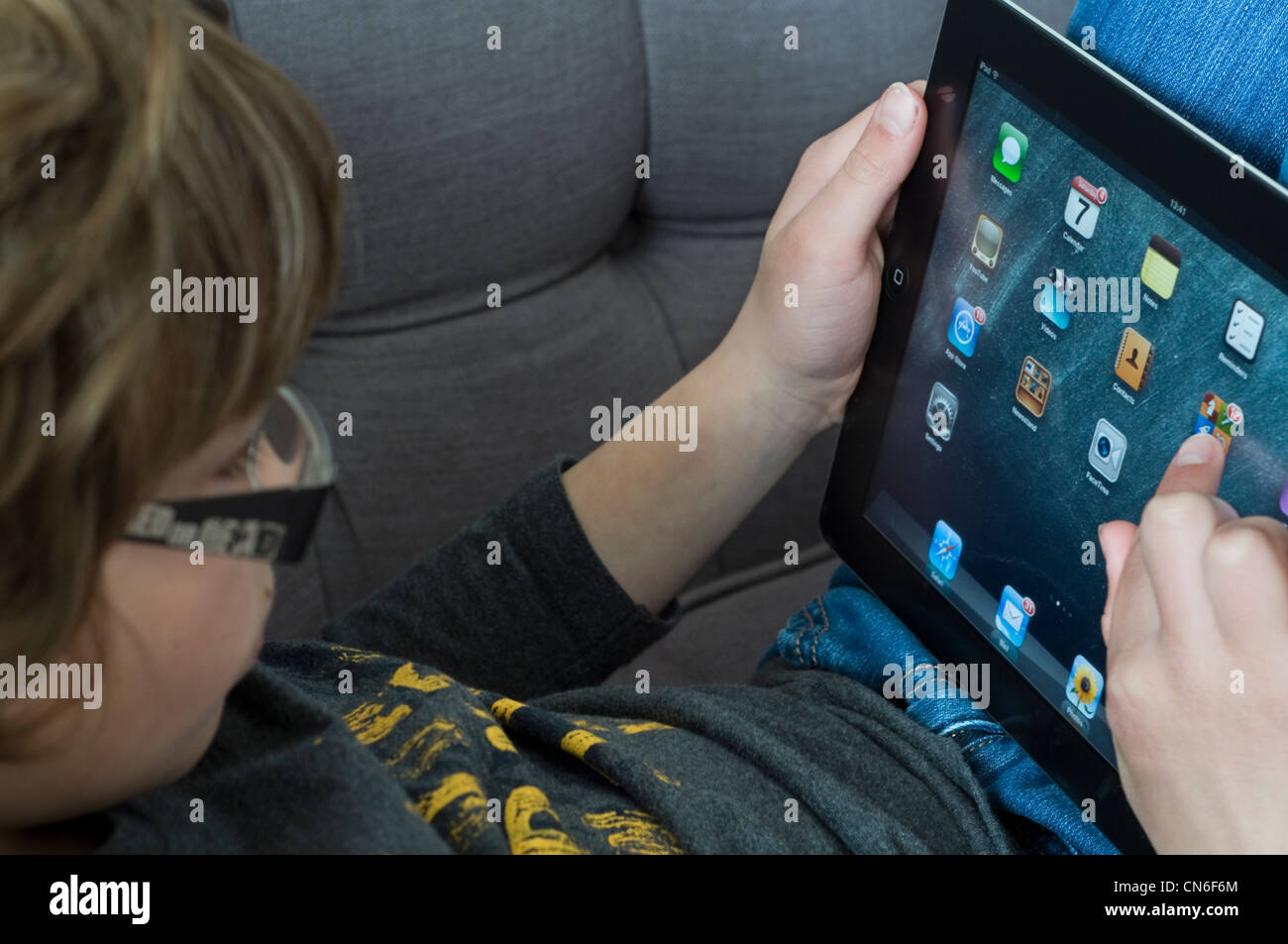 A young boy using an iPad 2 Stock Photo - Alamy